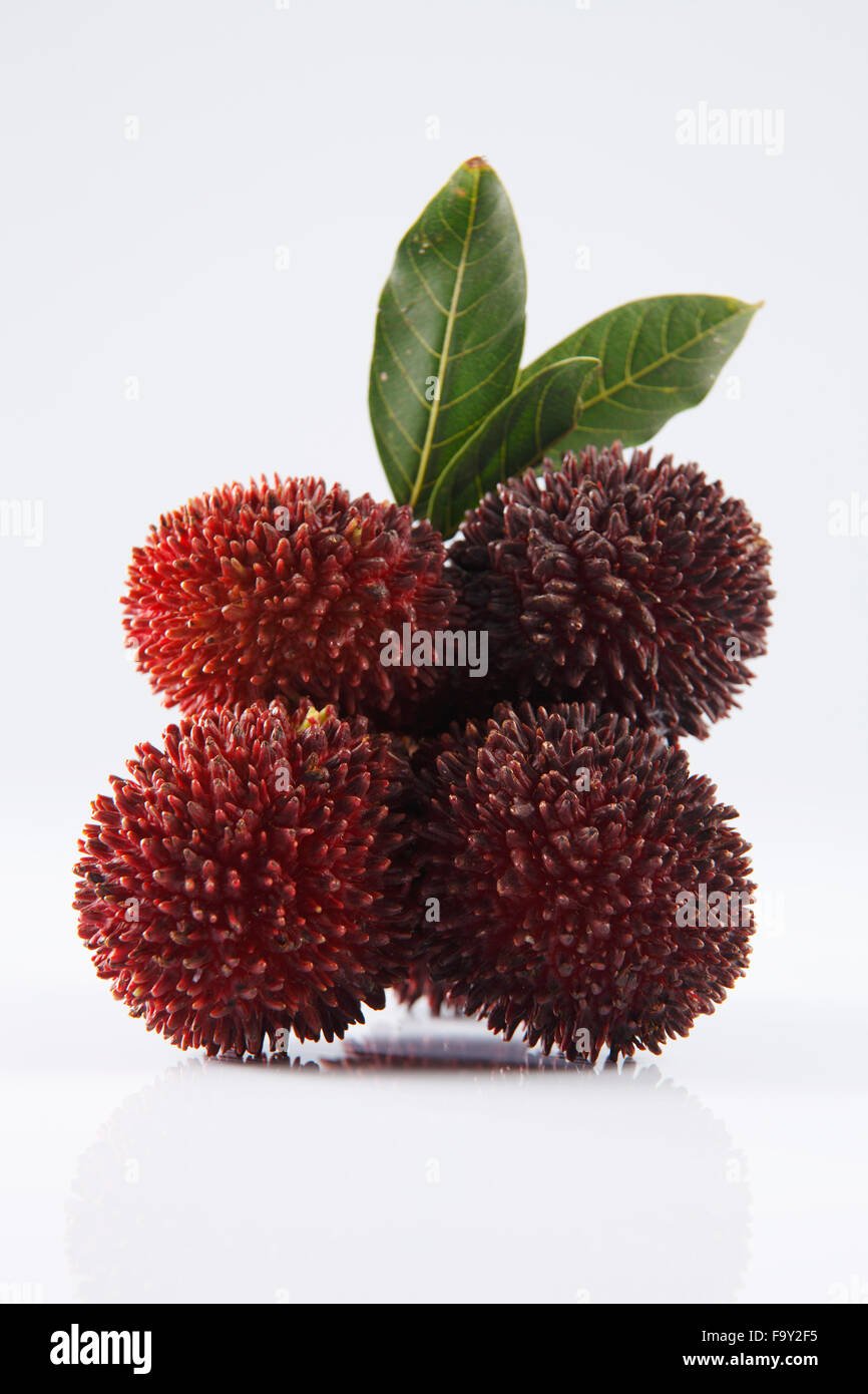 pulasan thick skin or wild rambutan on the white background Stock Photo ...