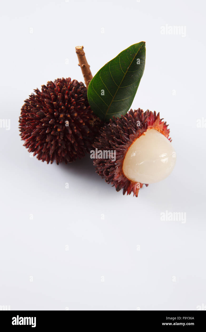 pulasan thick skin or wild rambutan on the white background Stock Photo ...