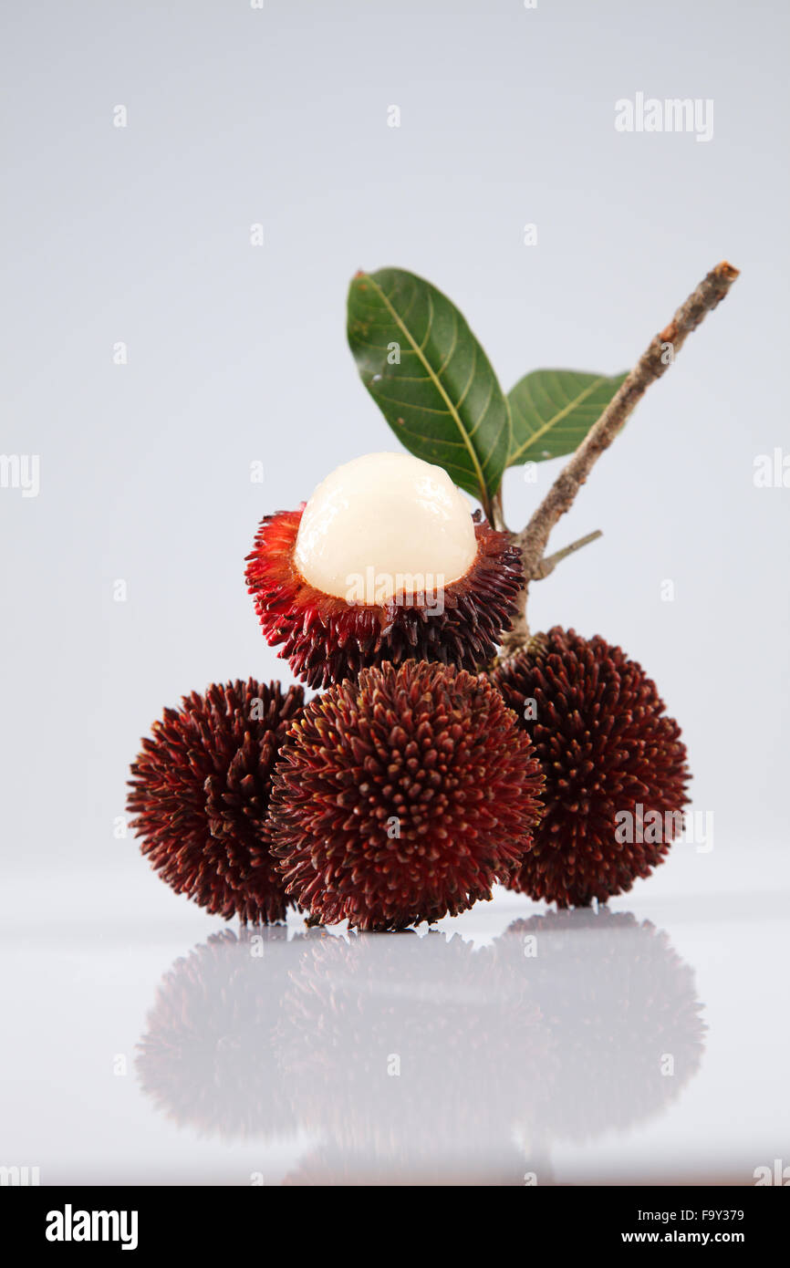 pulasan thick skin or wild rambutan on the white background Stock Photo ...