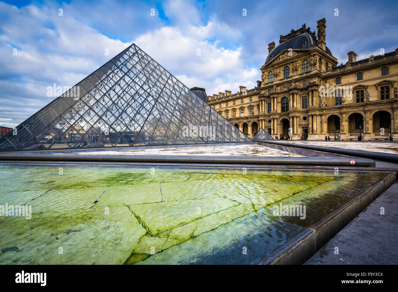 The Louvre Pyramid, in the courtyard of the Louvre Palace, in Paris ...