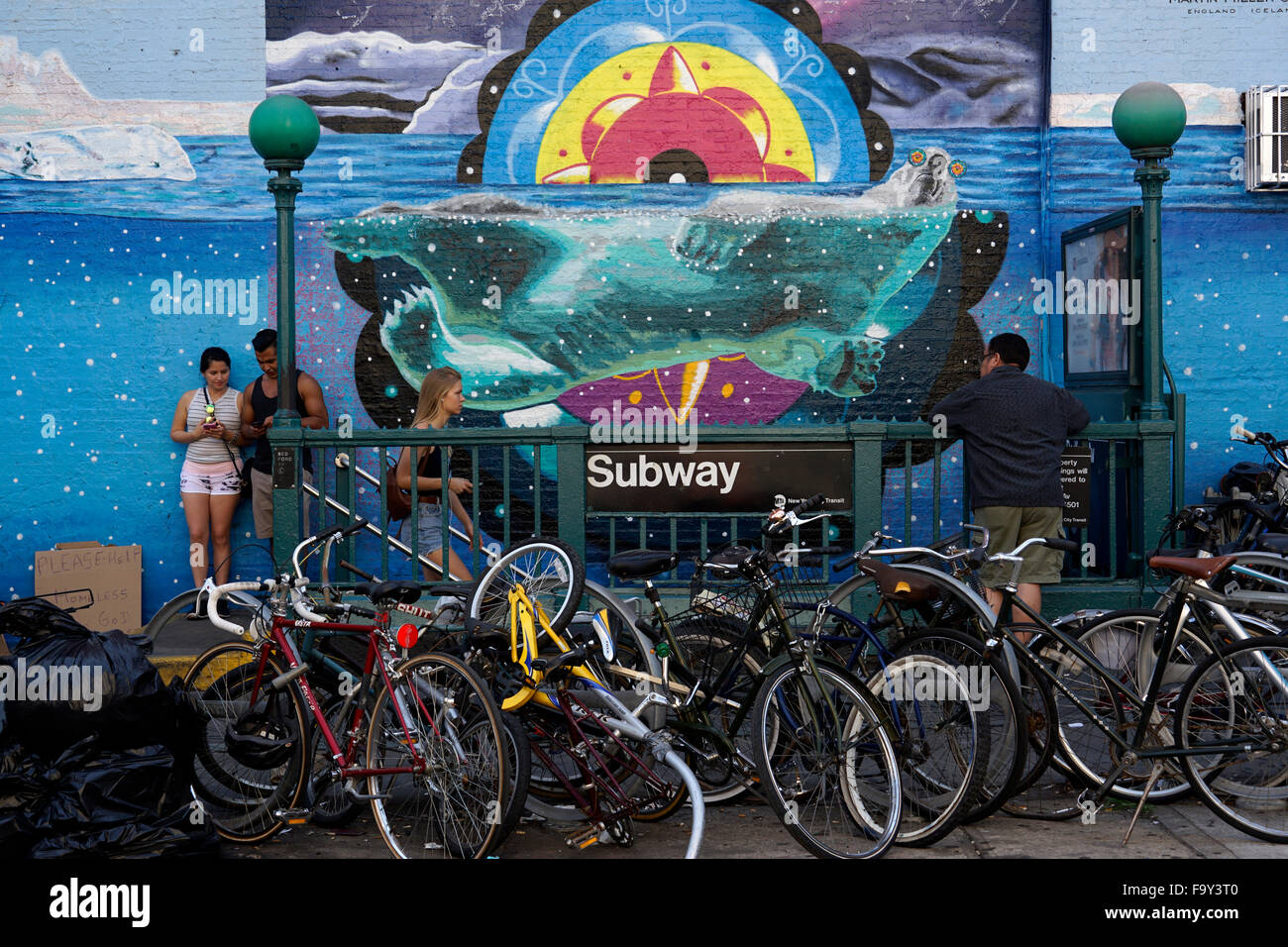 New York City subway station with ocean mural in the background and ...