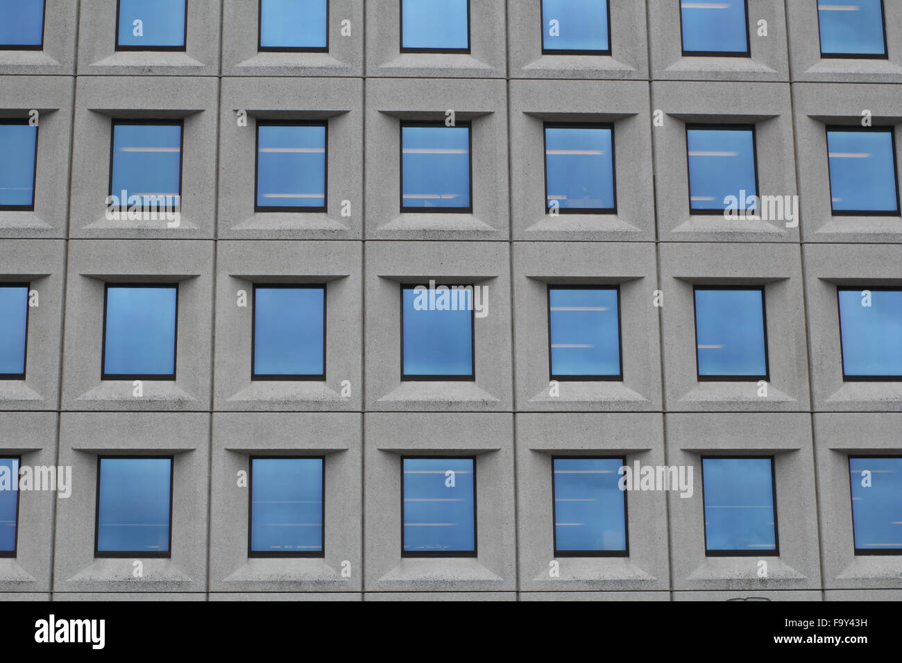 Square windows of a concrete building with a regular pattern Stock ...