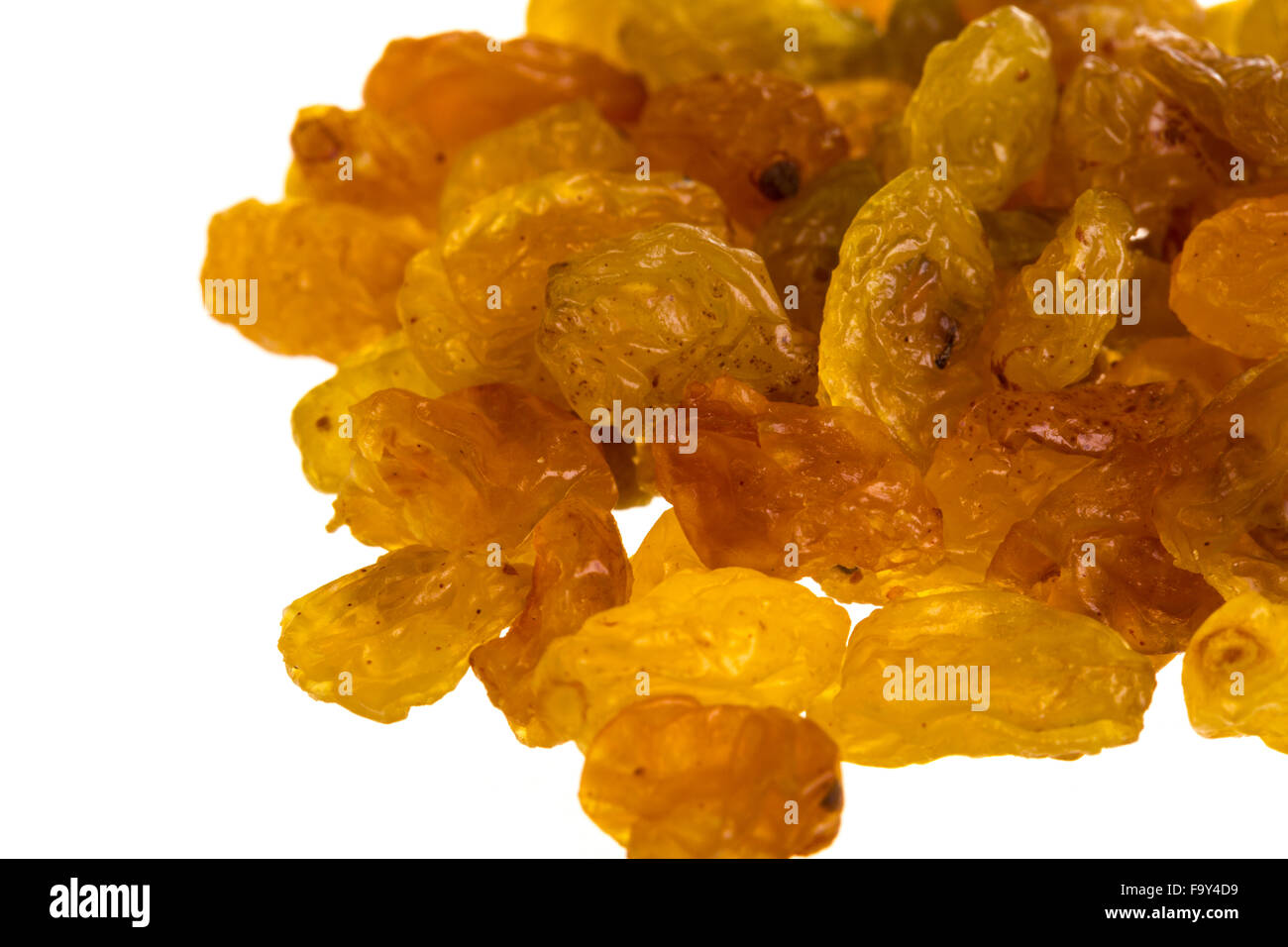 Golden raisins over white Stock Photo - Alamy