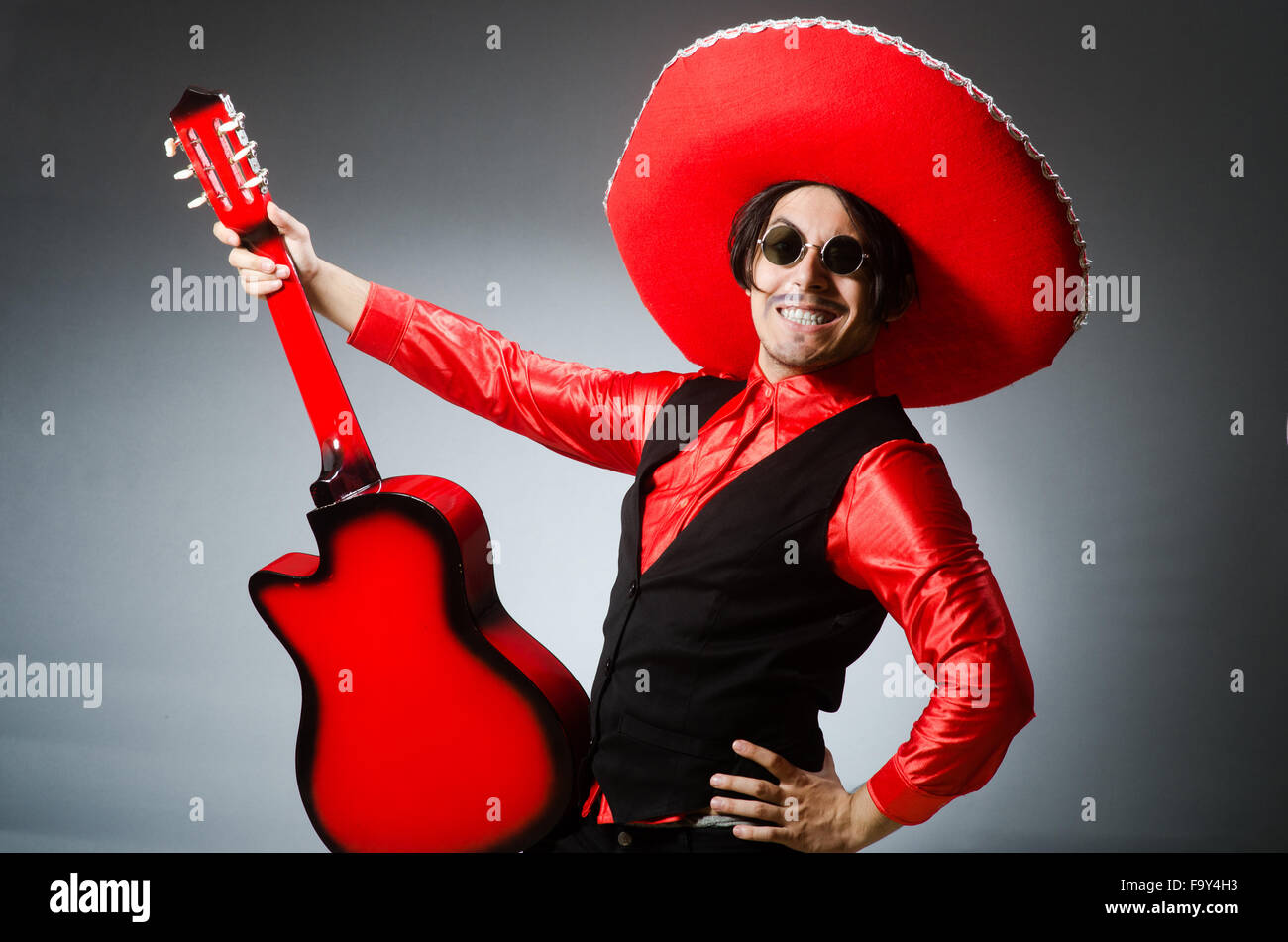 Mexican guitar player in red Stock Photo - Alamy