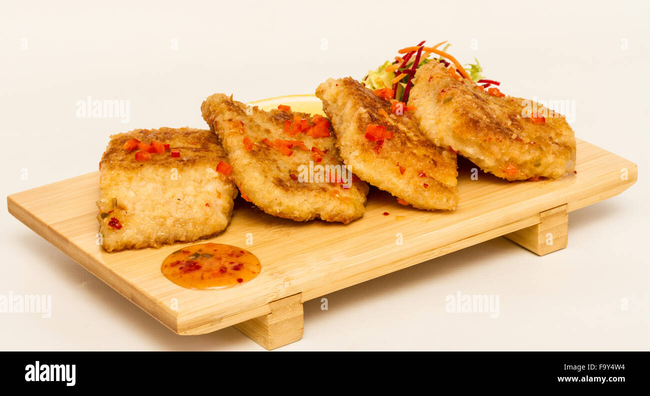 Fried fish fillets with salad Stock Photo - Alamy