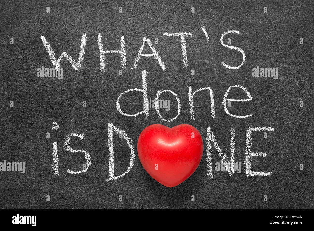 what done is done phrase handwritten on blackboard with heart symbol ...