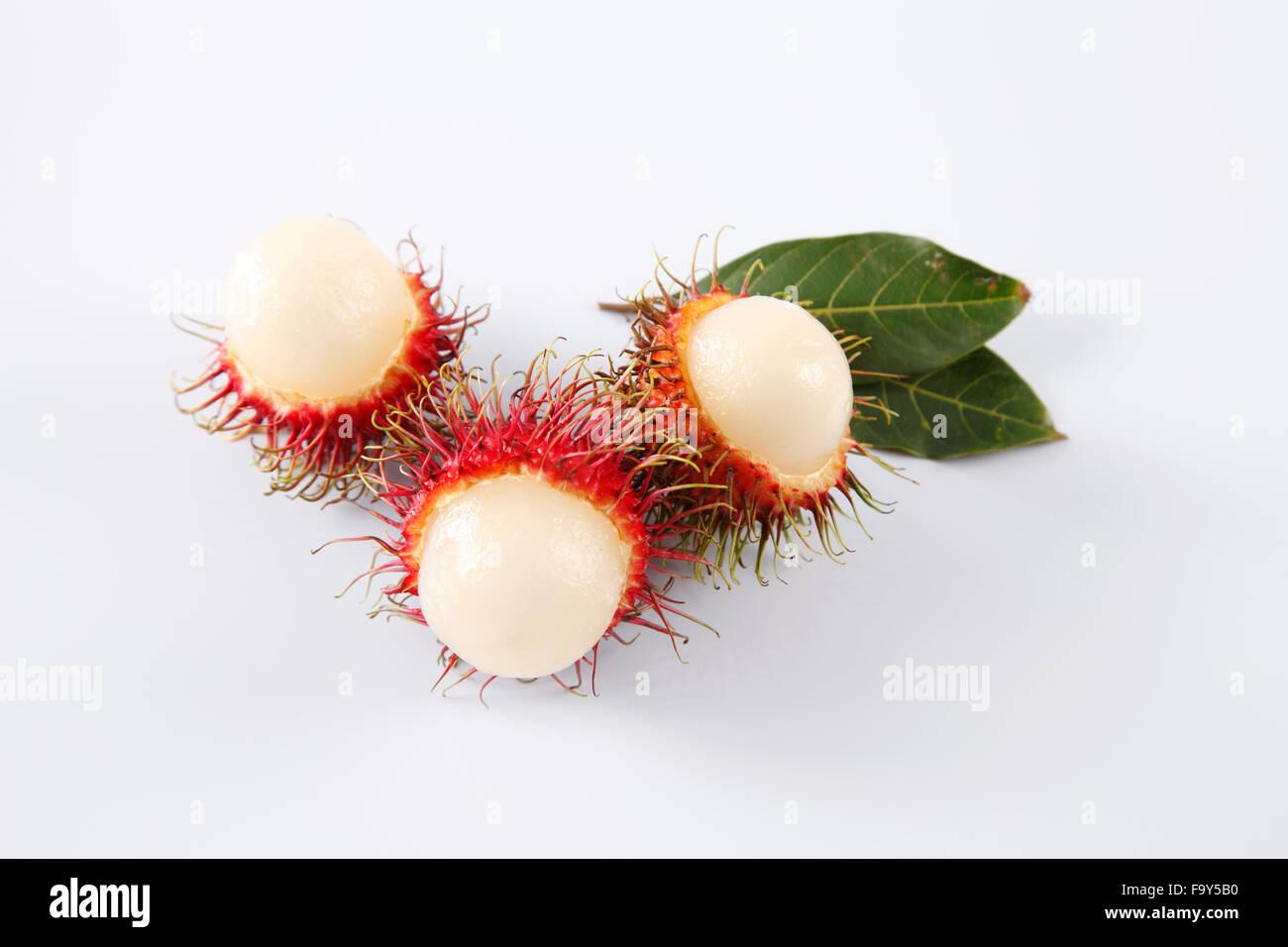 asian fruit rambutan on the plain background Stock Photo - Alamy