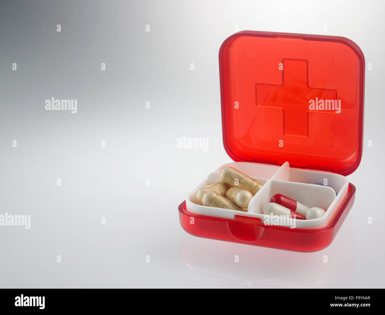 red pill box with medicine Stock Photo - Alamy