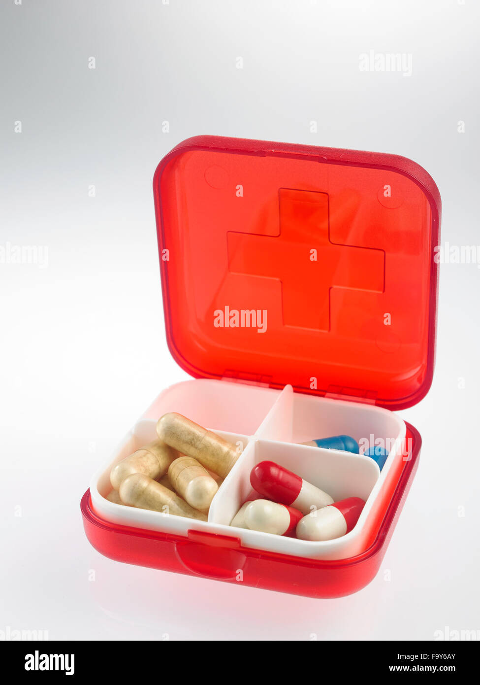 red pill box with medicine Stock Photo - Alamy