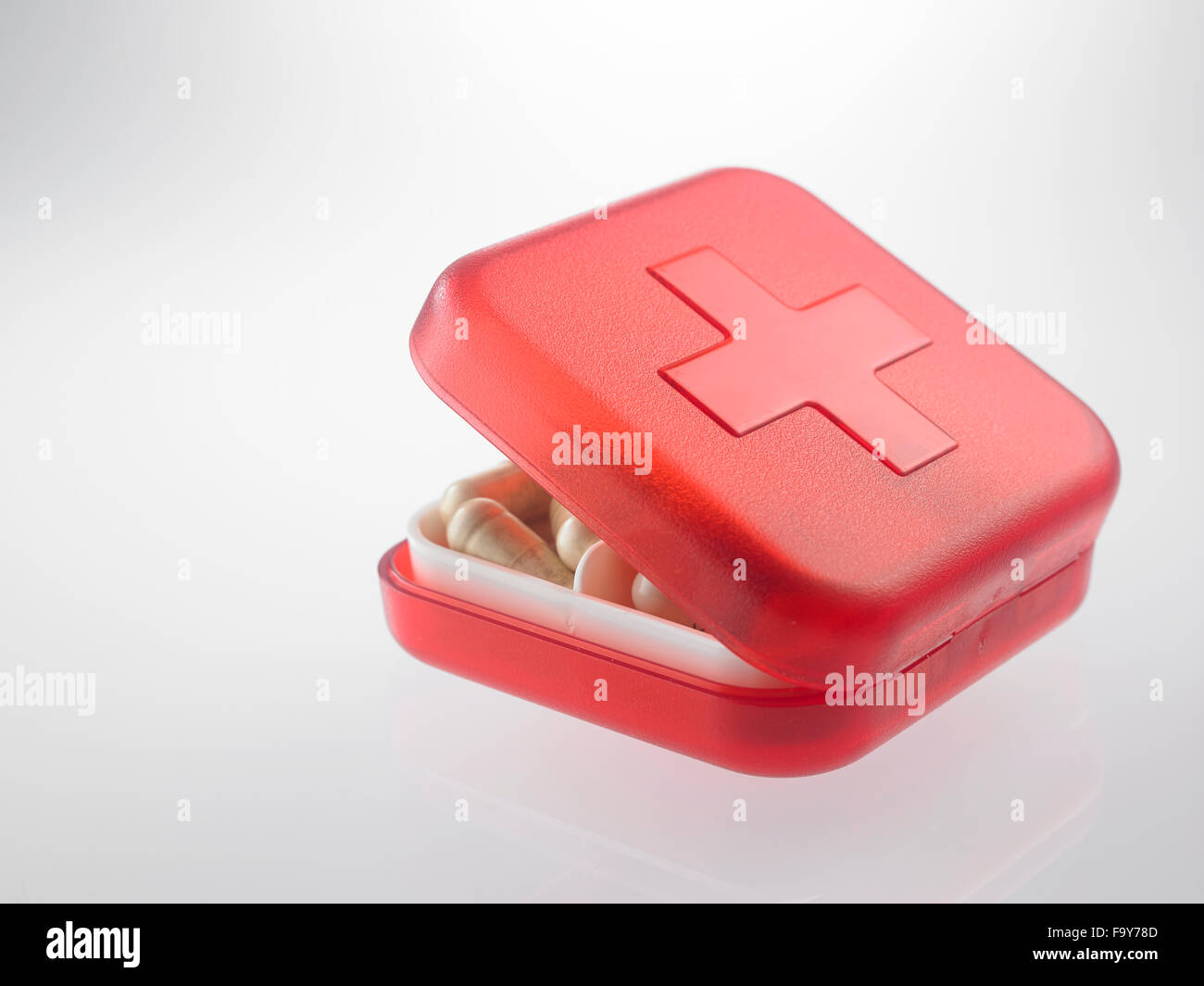 red pill box with medicine Stock Photo - Alamy