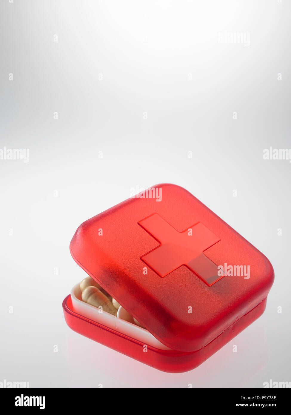 red pill box with medicine Stock Photo - Alamy