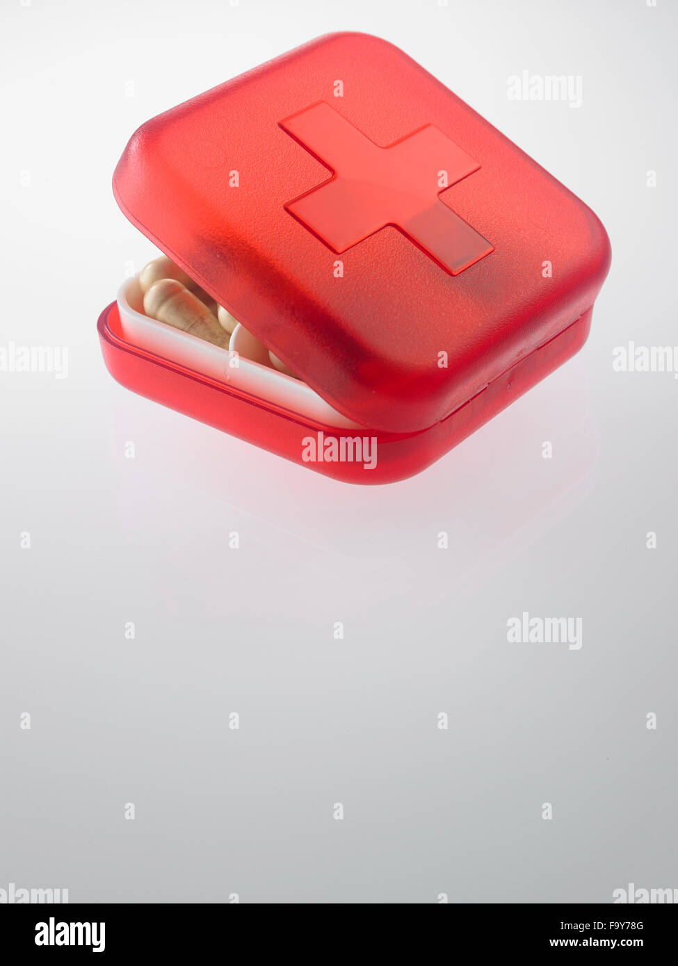 red pill box with medicine Stock Photo - Alamy