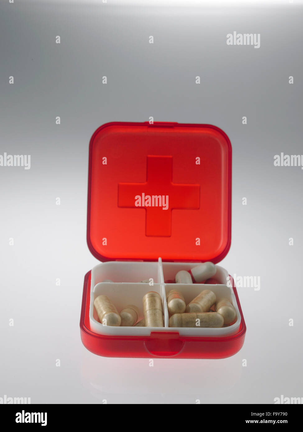 red pill box with medicine Stock Photo - Alamy