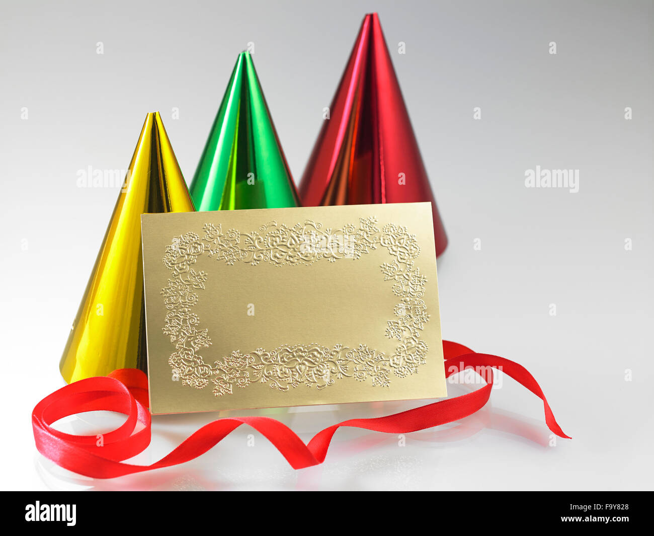 golden invitation card with ribbon Stock Photo - Alamy