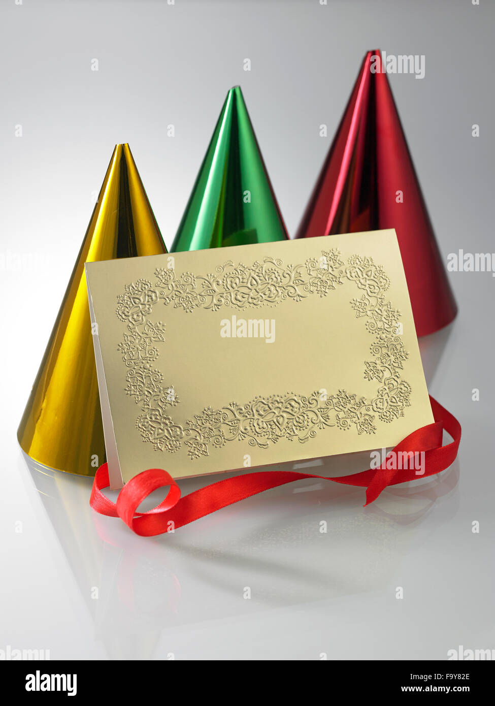 golden invitation card with ribbon Stock Photo - Alamy