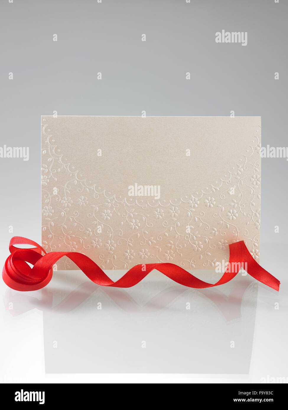 blank greeting card with red ribbon Stock Photo - Alamy