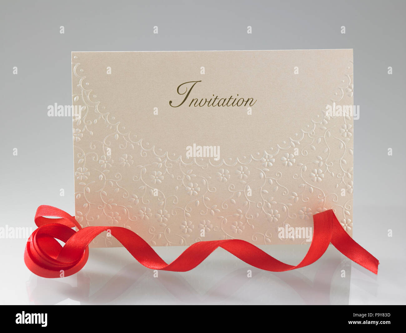 invitation card with red ribbon Stock Photo - Alamy