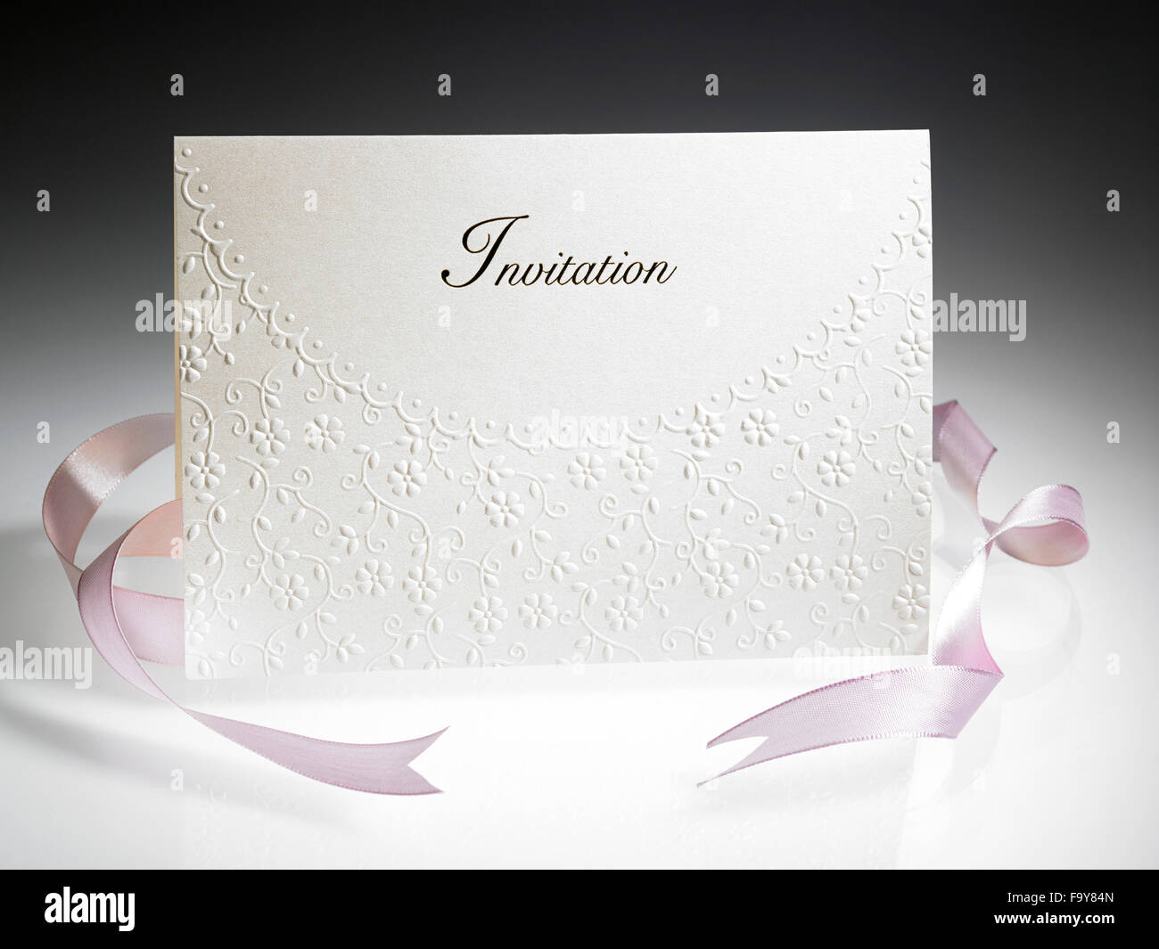 invitation card with pink ribbon Stock Photo - Alamy