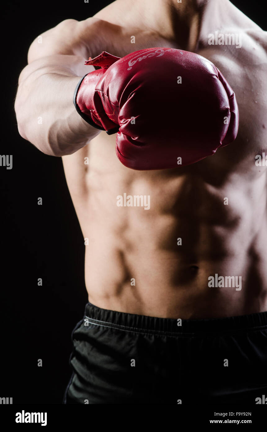 Muscular man in boxing concept Stock Photo - Alamy
