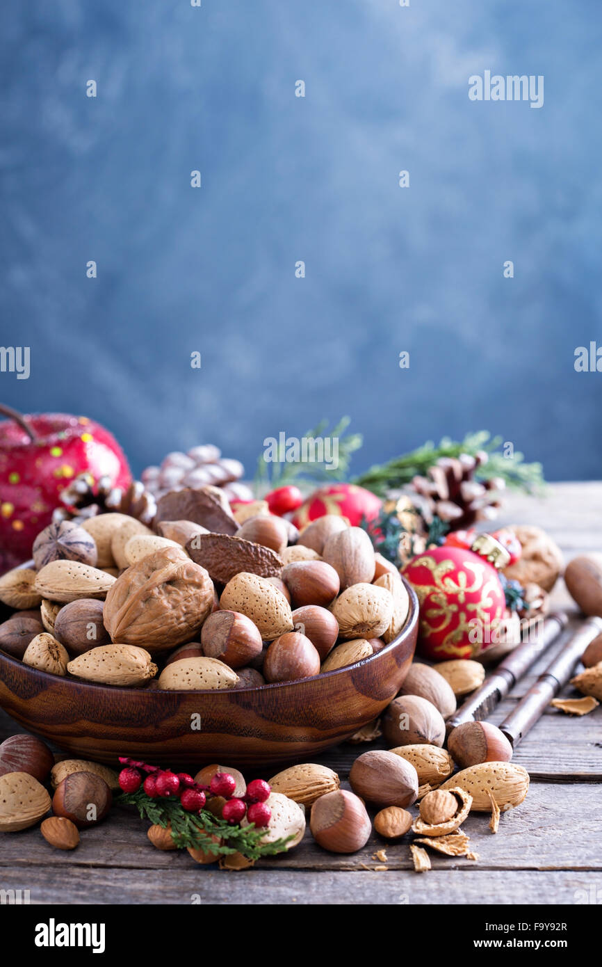 Variety of nuts with shells in a brown bowl Stock Photo - Alamy
