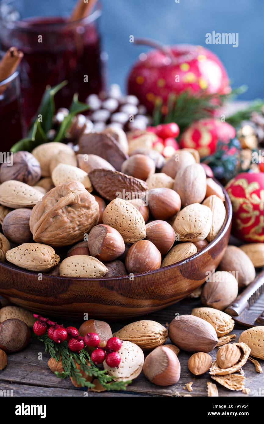 Variety of nuts with shells in a brown bowl Stock Photo - Alamy