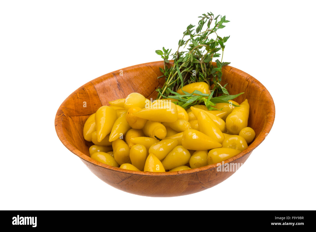 Yellow marinated pepper with thyme Stock Photo - Alamy