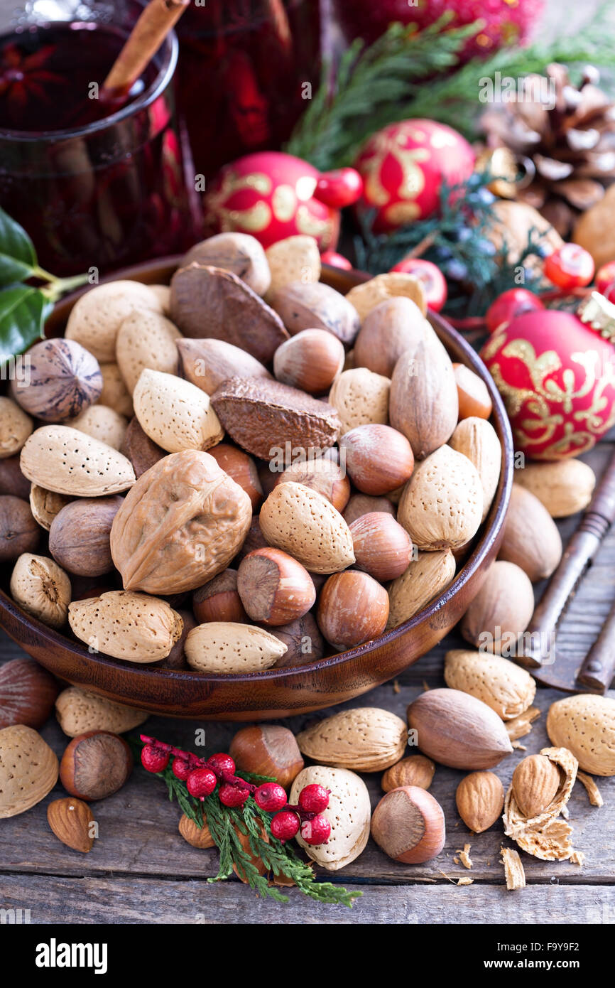 Variety of nuts with shells in a brown bowl Stock Photo - Alamy
