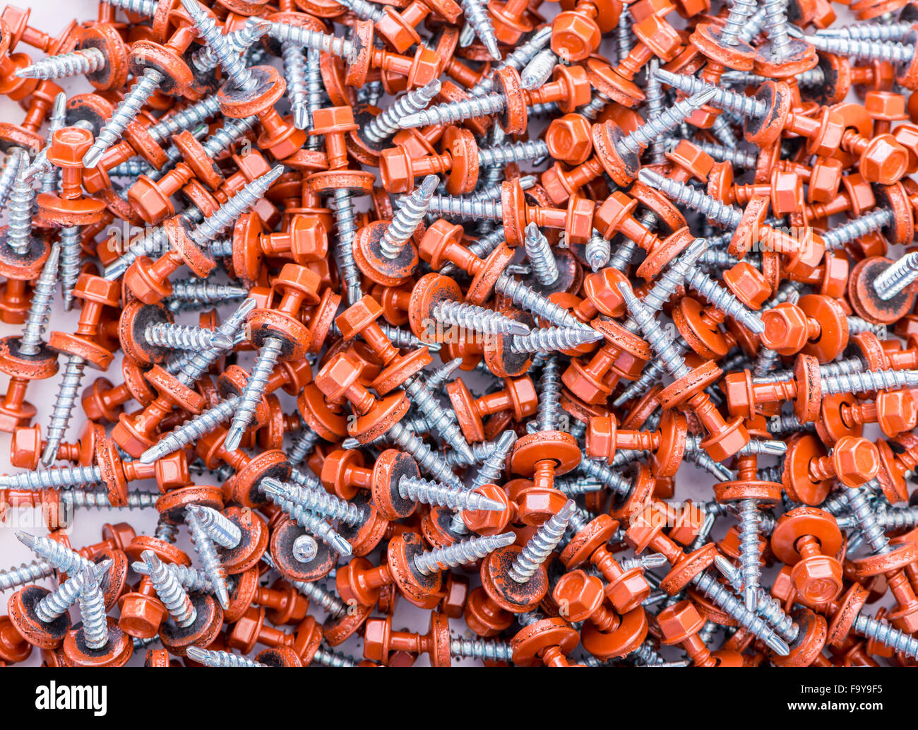Many screws arranged as background Stock Photo - Alamy