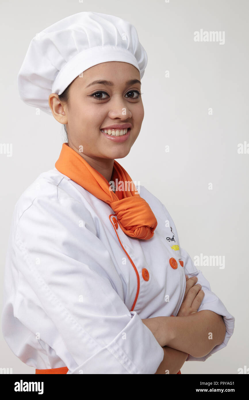 Portrait of a Indian woman with chef uniform with confident Stock Photo ...