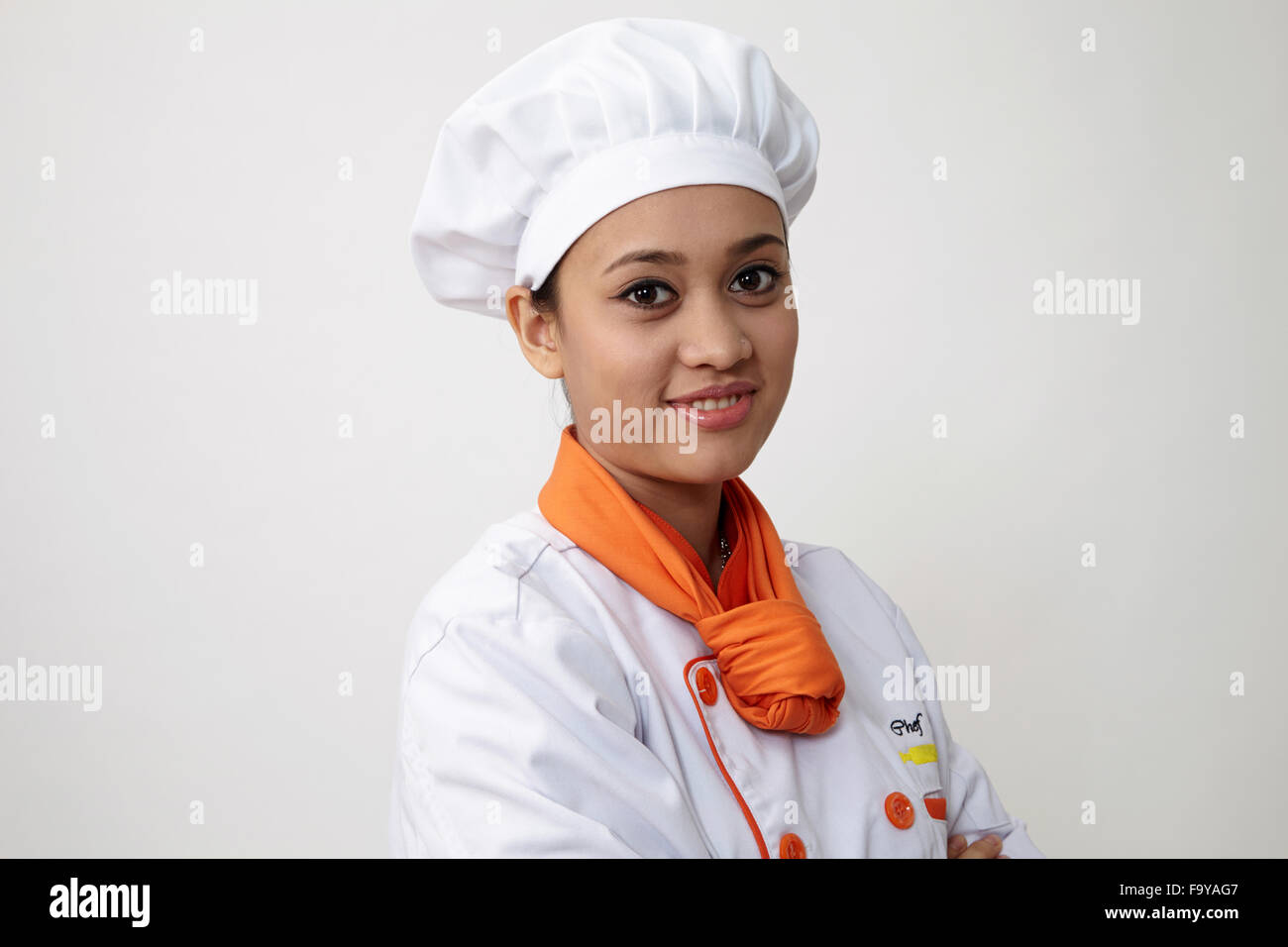 Portrait of a Indian woman with chef uniform with confident Stock Photo ...