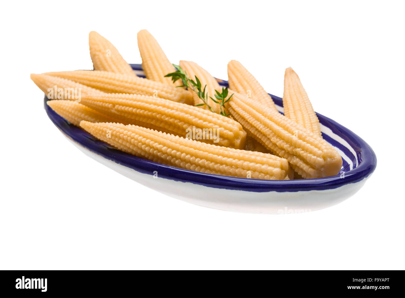 Baby corn with thyme Stock Photo - Alamy