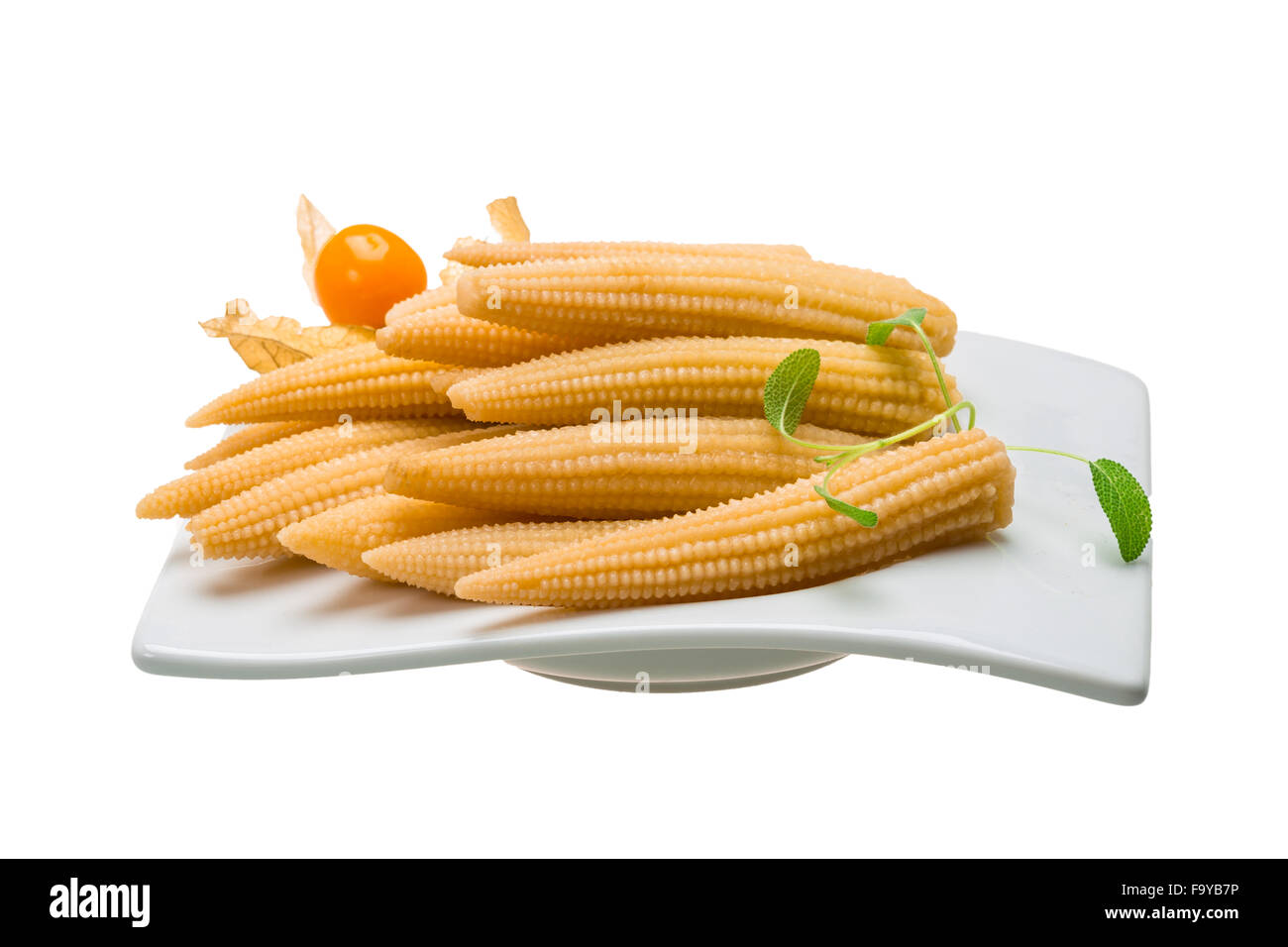 Baby corn with thyme Stock Photo - Alamy