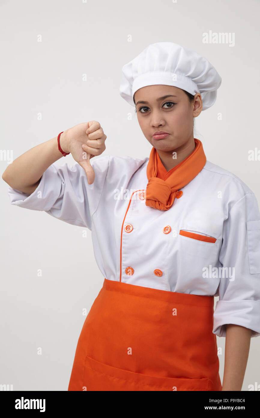 woman chef sad expression with thumb down Stock Photo - Alamy