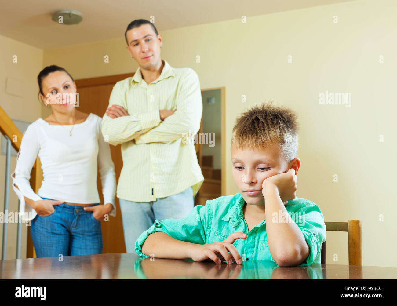 teenage son and parents having quarrel at home Stock Photo - Alamy