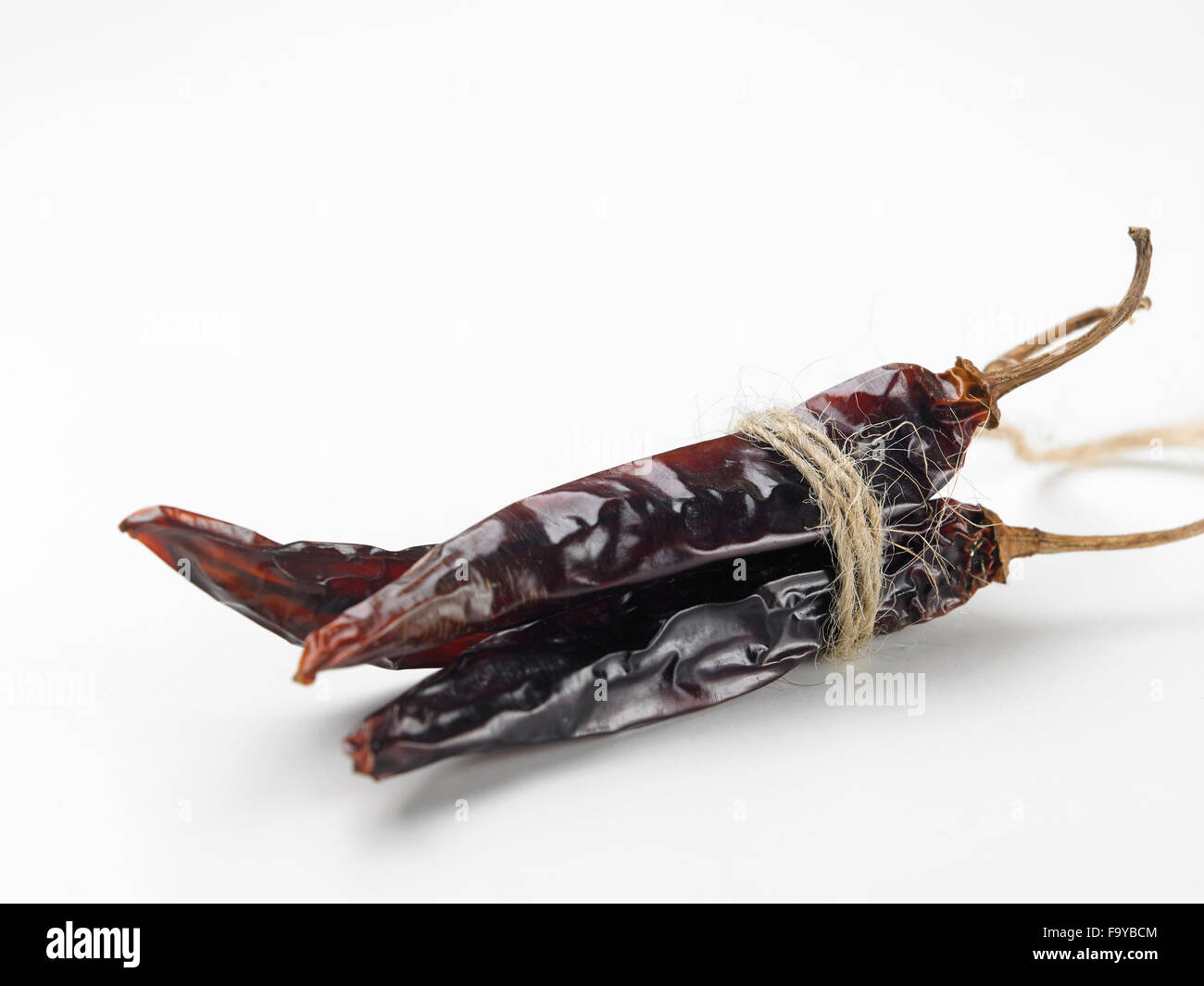 bunch of the dried chilli on white background Stock Photo - Alamy