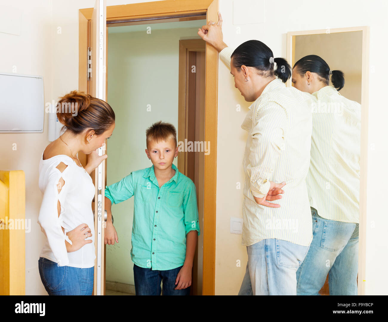 Parents scold his son, who later returned home Stock Photo - Alamy