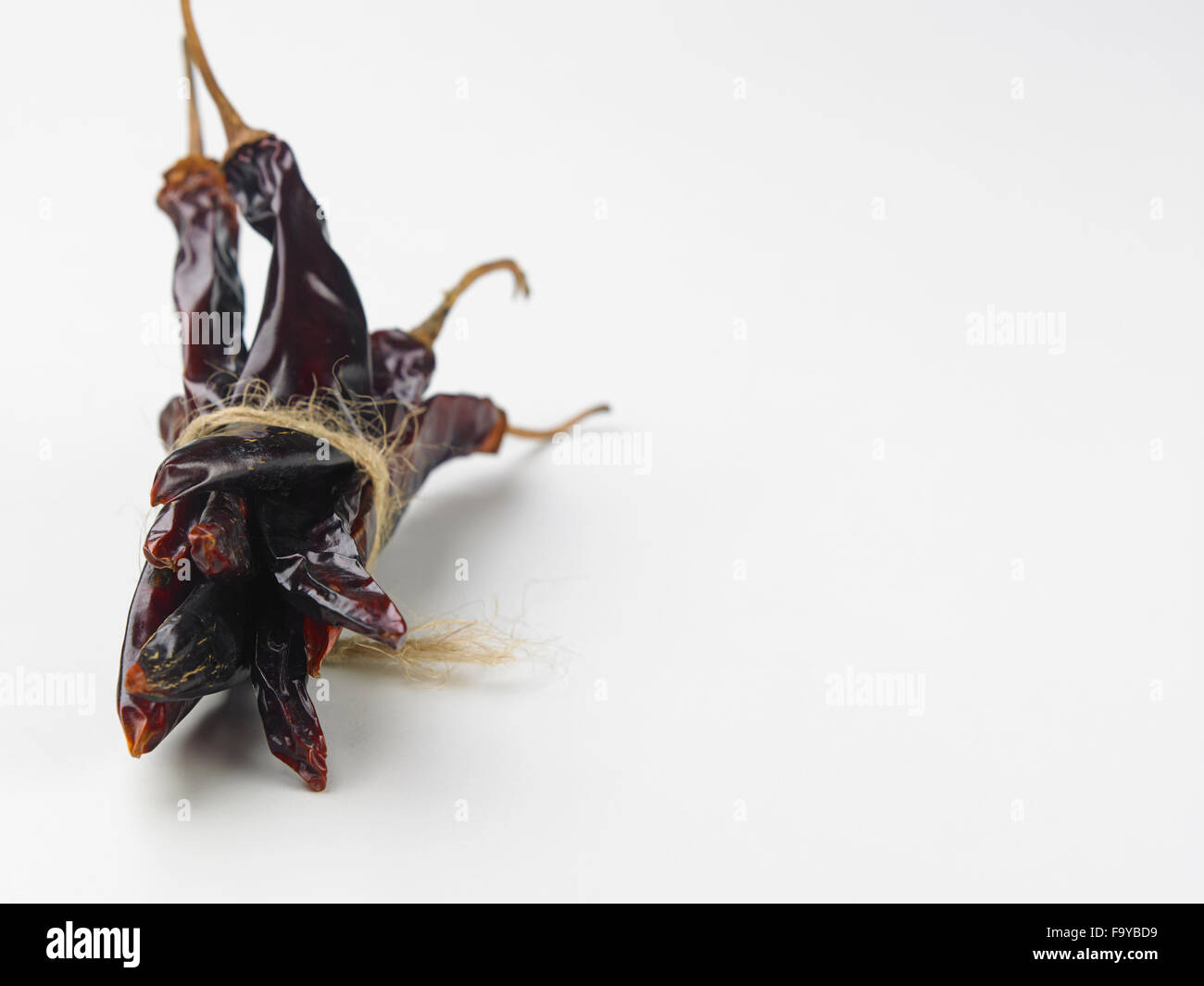 bunch of the dried chilli on white background Stock Photo - Alamy