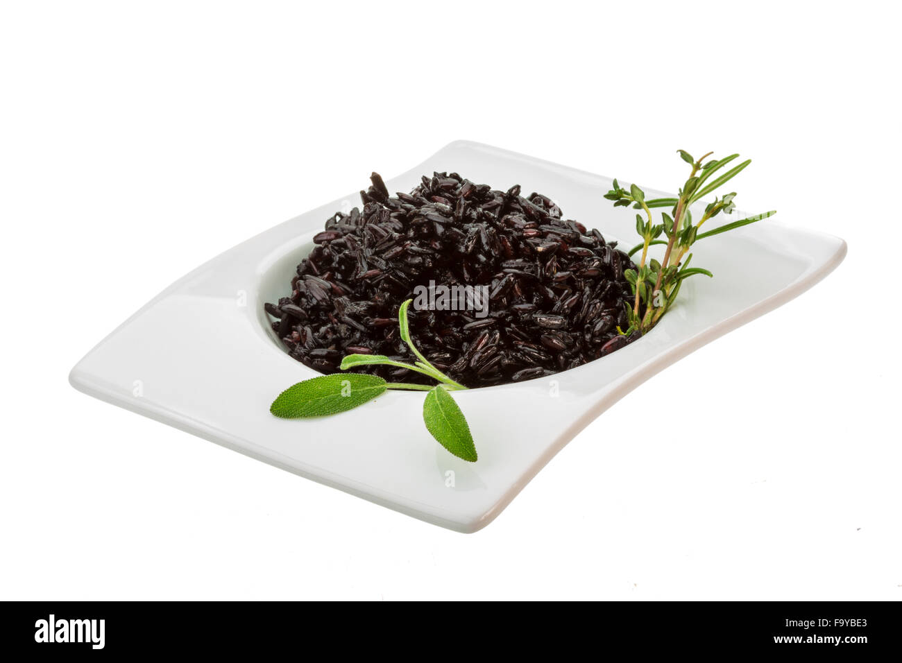 Black boiled rice with thyme Stock Photo - Alamy