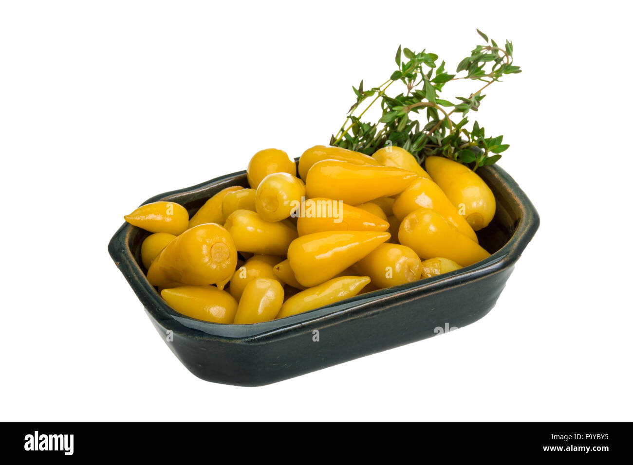Yellow marinated pepper with thyme Stock Photo - Alamy