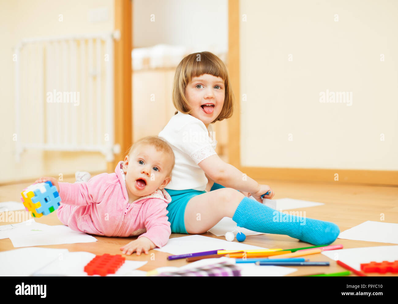 Two happy siblings together in home interior Stock Photo - Alamy