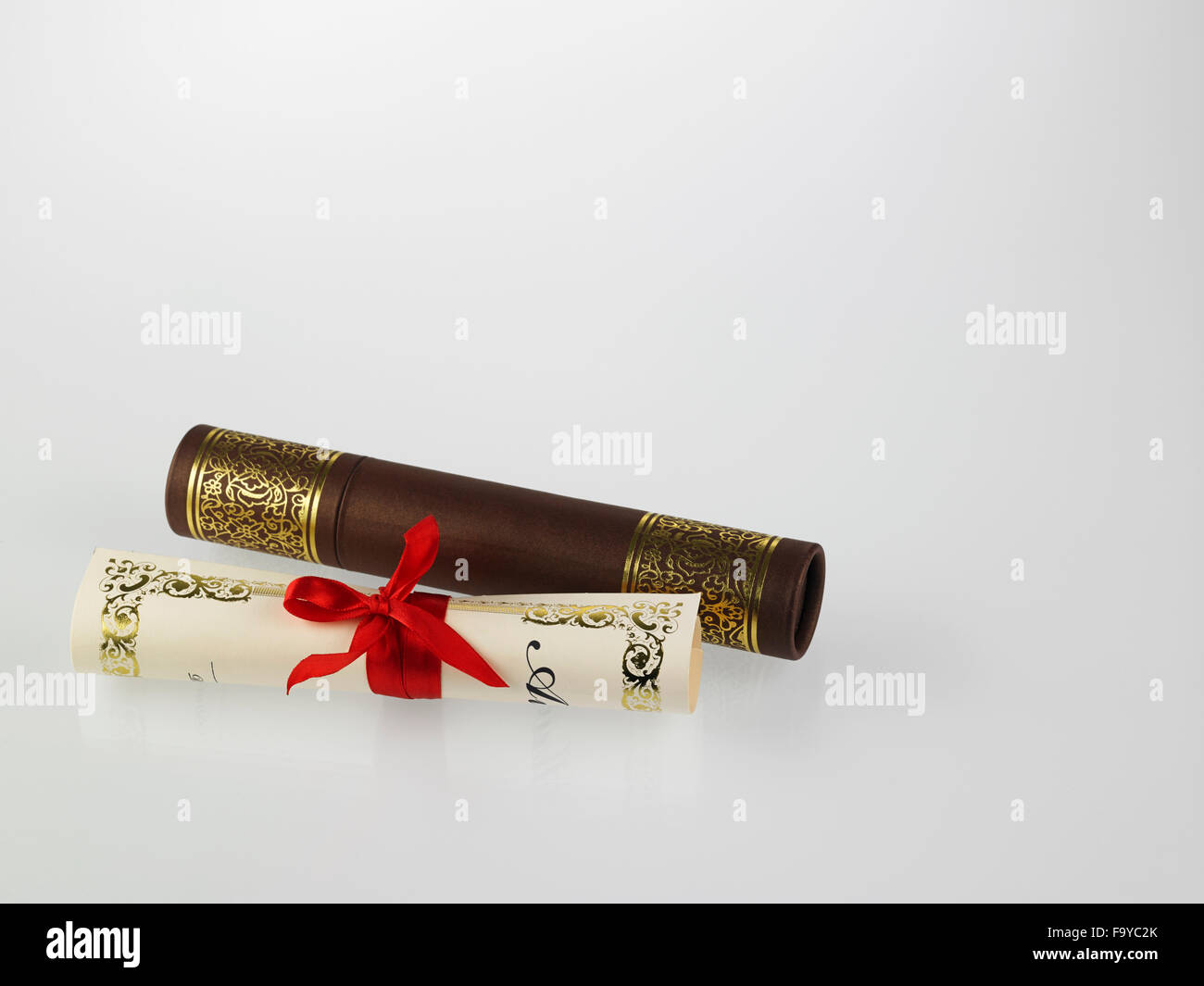 Graduation Certificate and Open Scroll Container On White Background ...