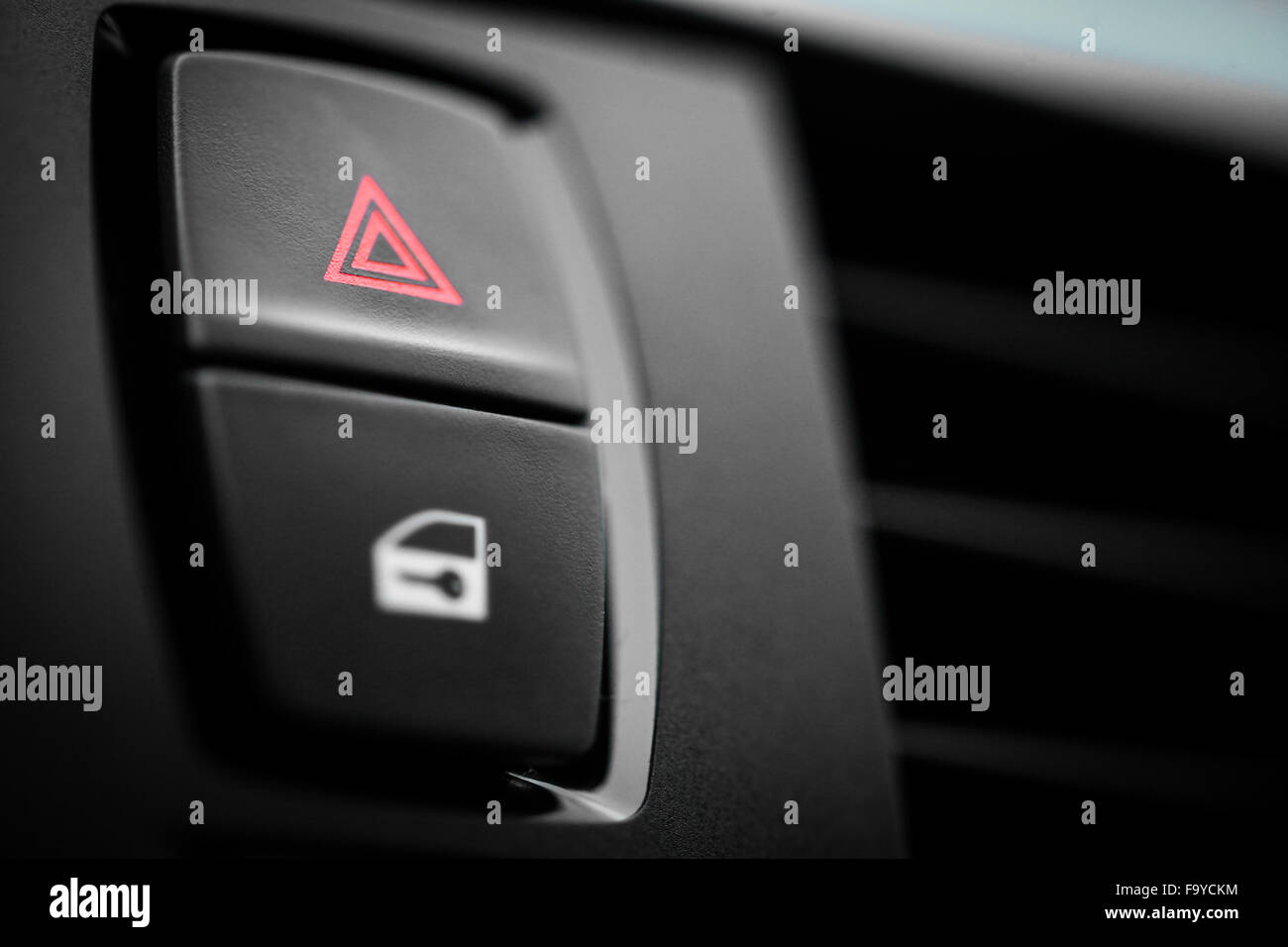 Detail of a warning button in a car Stock Photo - Alamy