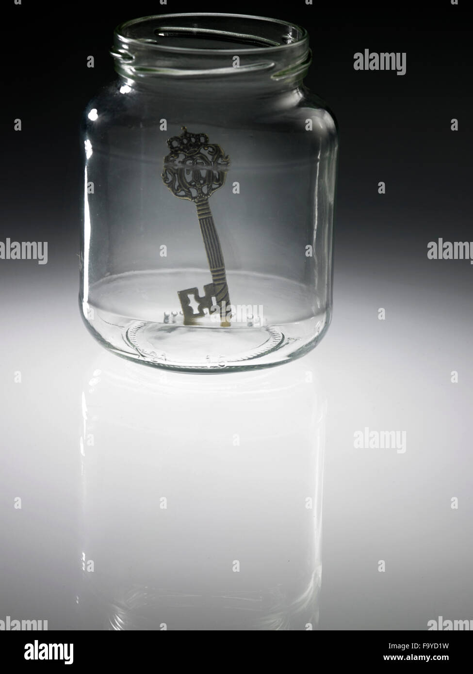 key in the empty jar Stock Photo - Alamy