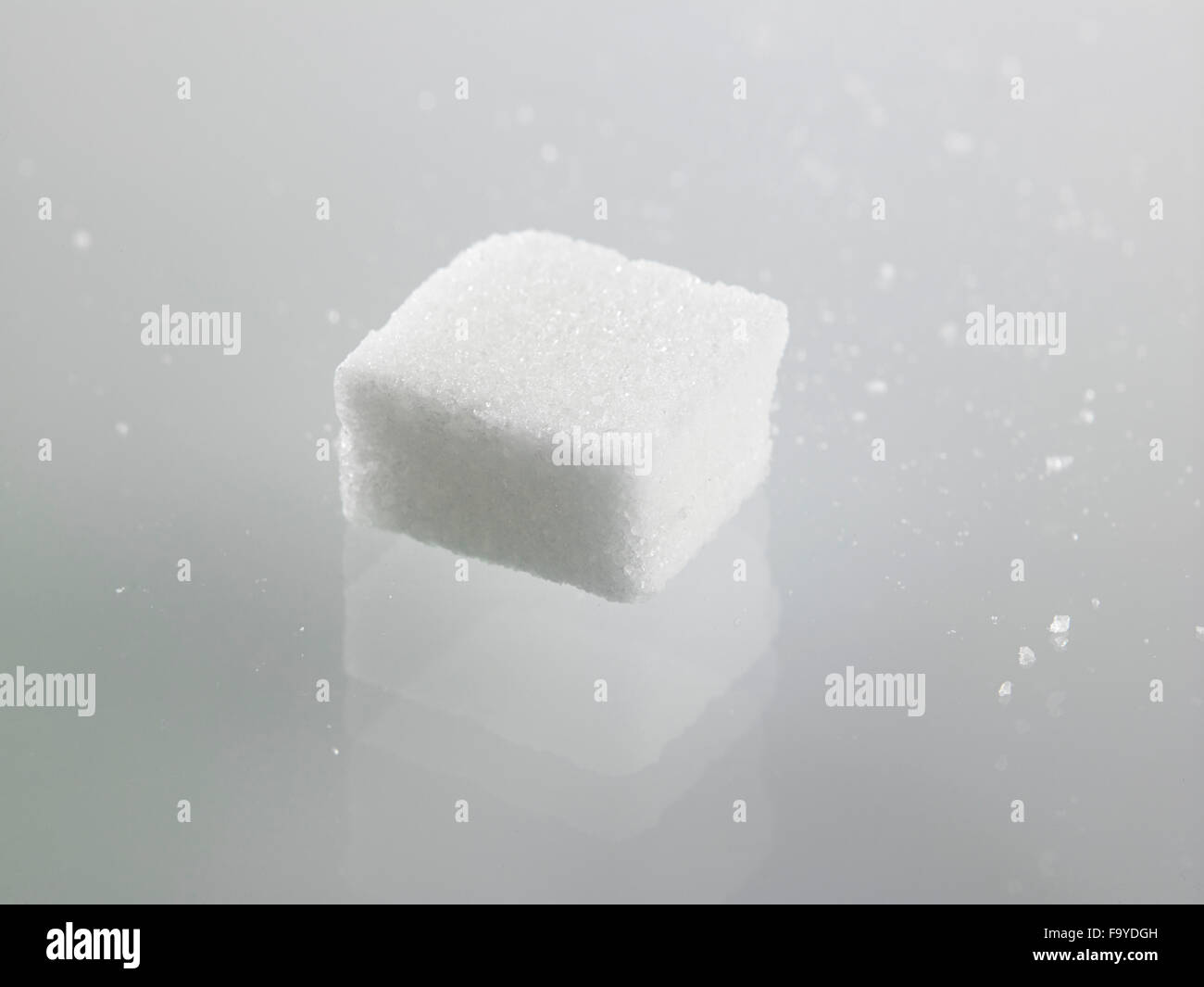 cube sugar on the gray background Stock Photo - Alamy