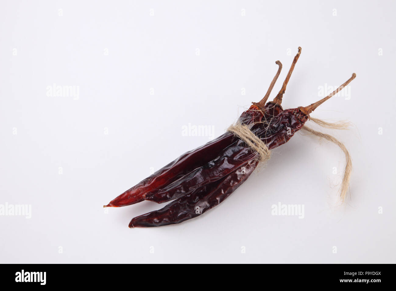 bunch of the dried chilli on the white background Stock Photo - Alamy