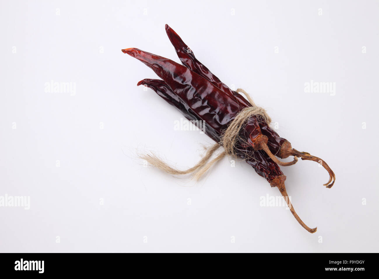 bunch of the dried chilli on the white background Stock Photo - Alamy