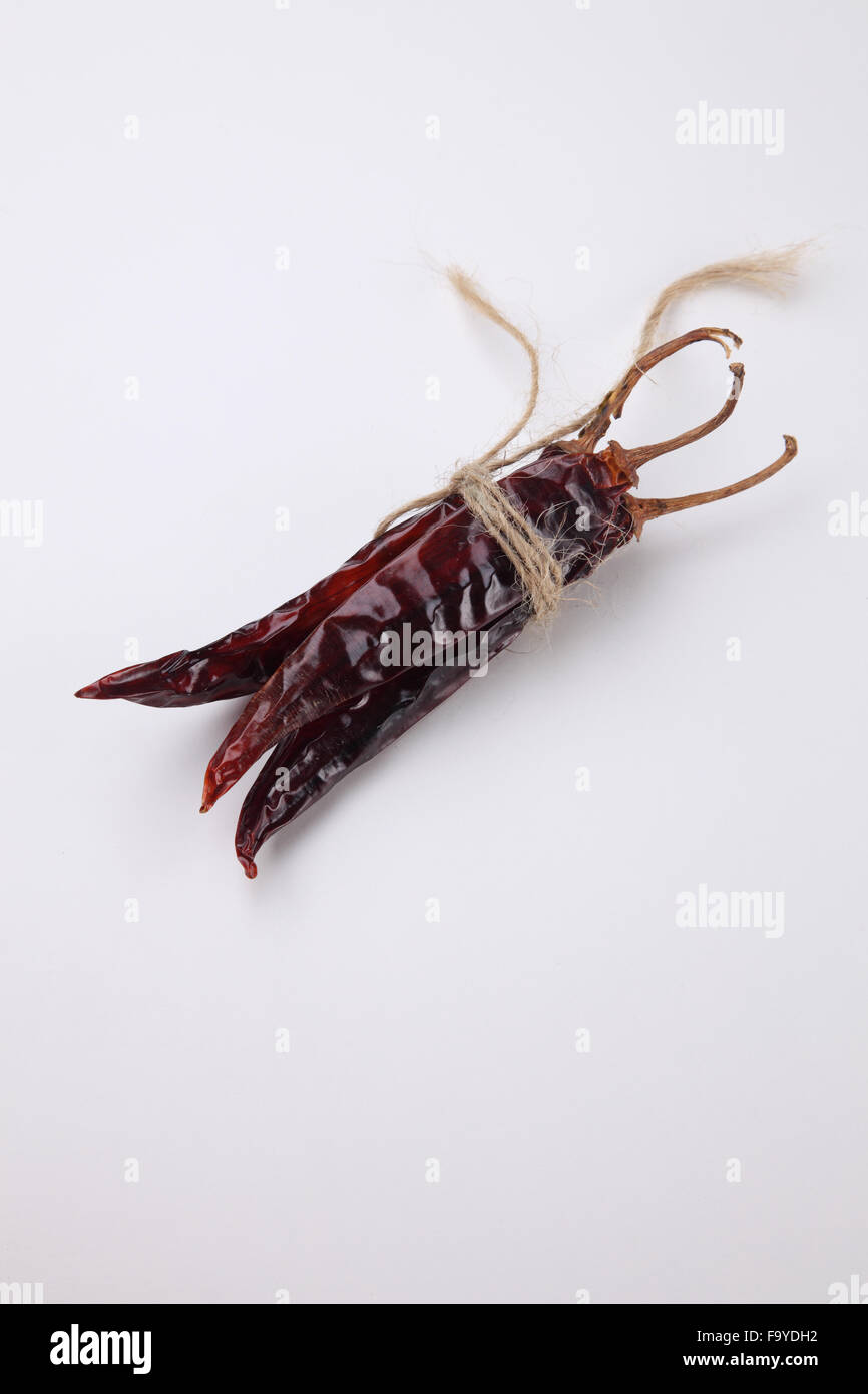 bunch of the dried chilli on the white background Stock Photo - Alamy