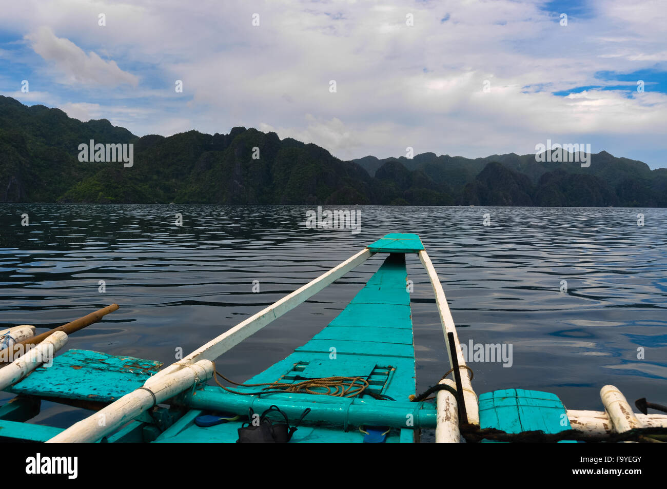 Tip of a Boat Facing ocean water and Mountain Stock Photo - Alamy