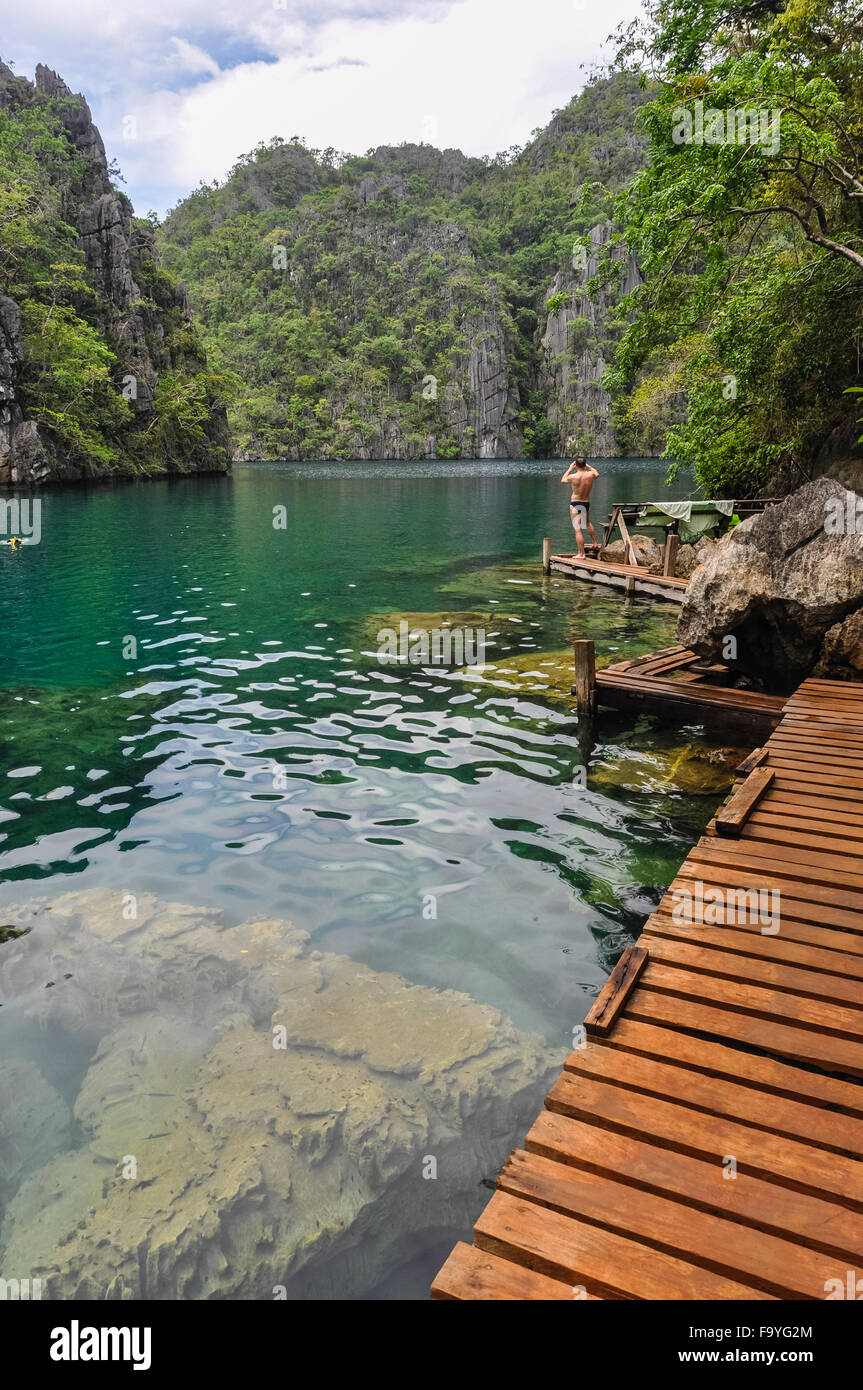 Very Clean and Clear lagoon lake Water next to a wooden path Stock ...
