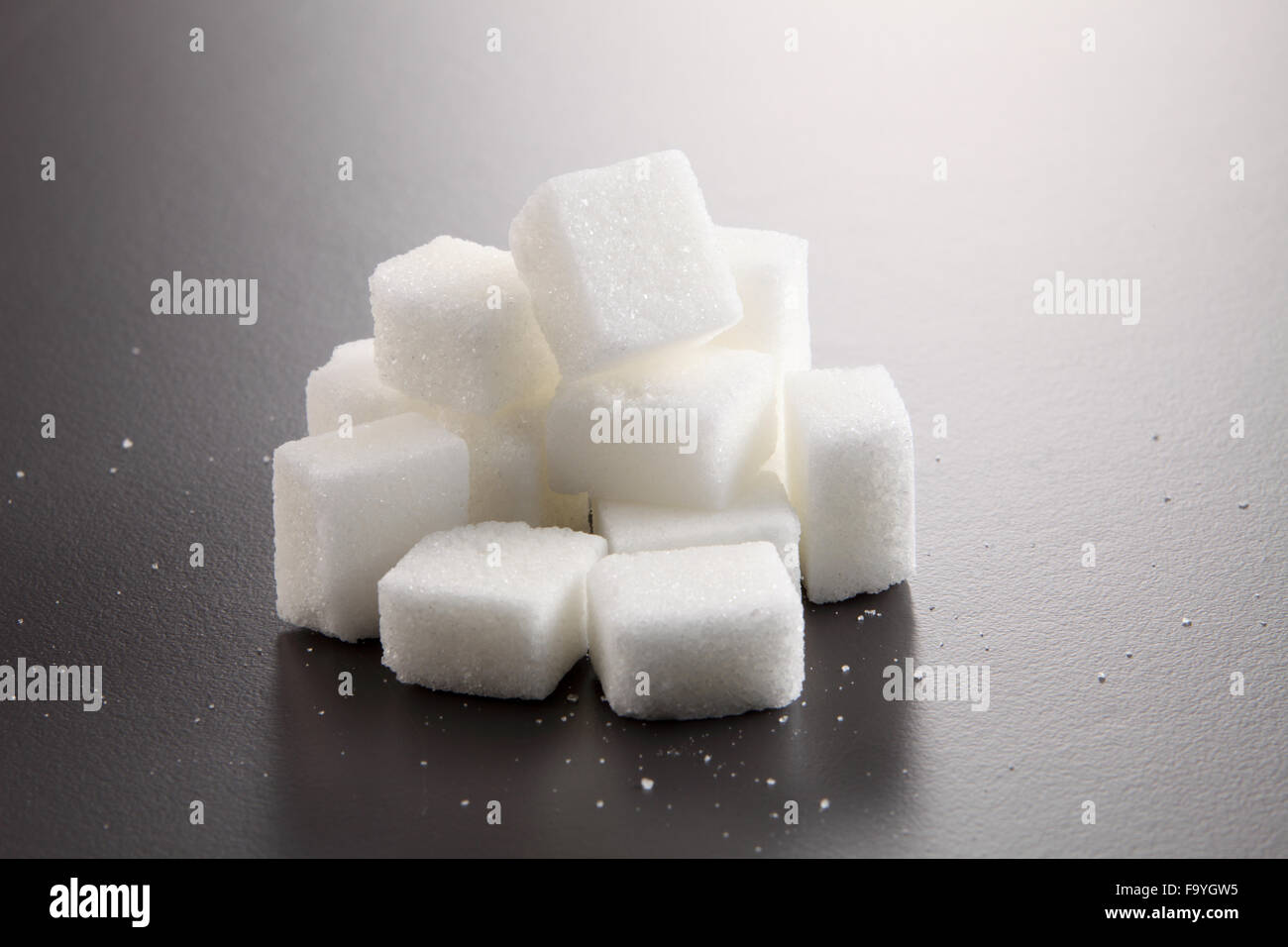 sugar cube on gray background Stock Photo - Alamy